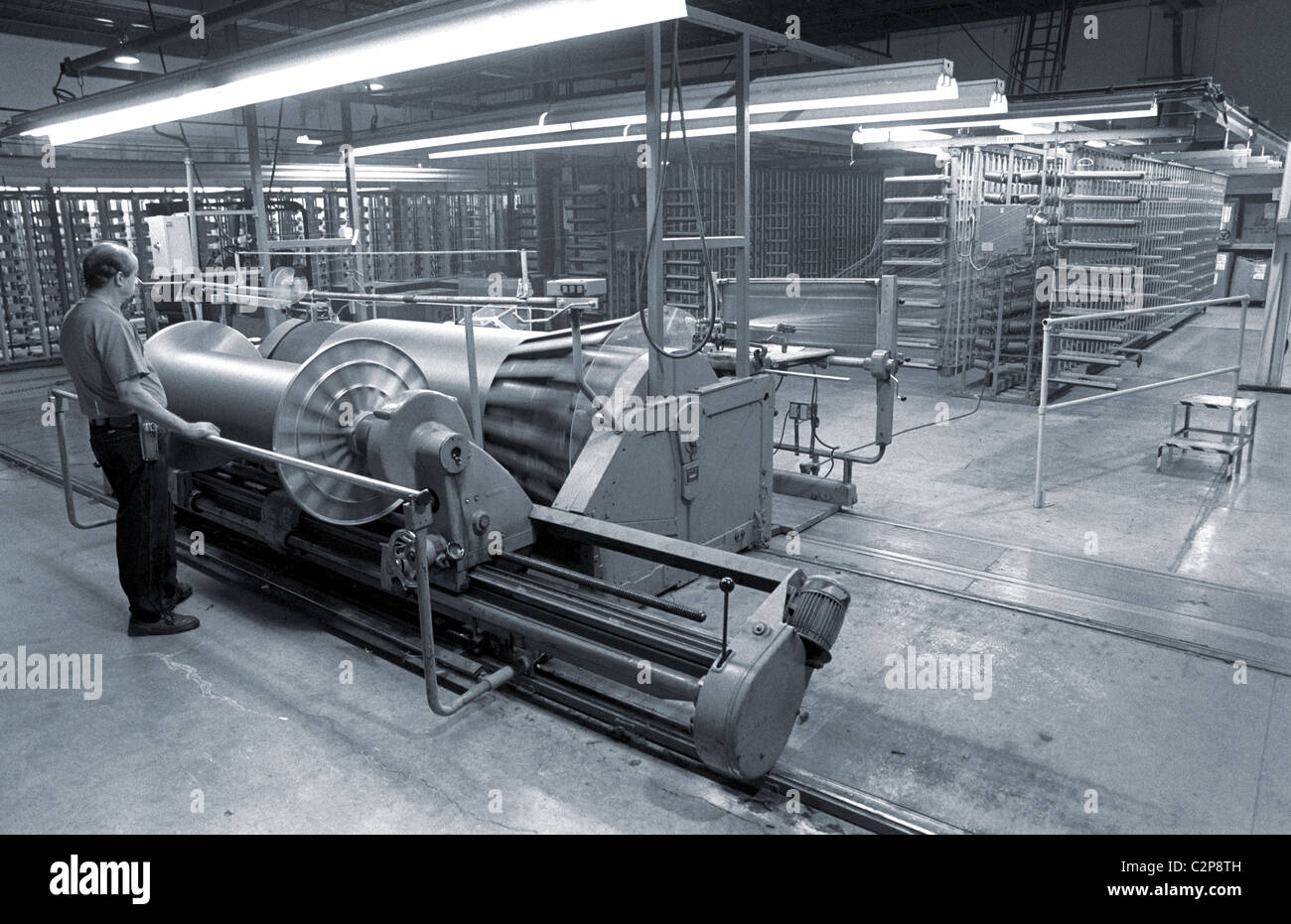 A man, blue collar worker, working with his hands in a clothing and ...