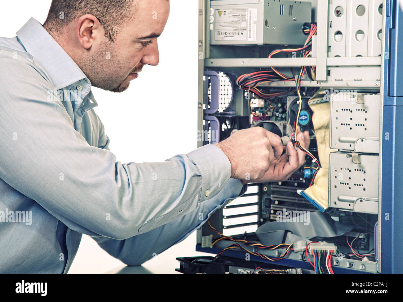 man try to repair his pc on white background Stock Photo - Alamy