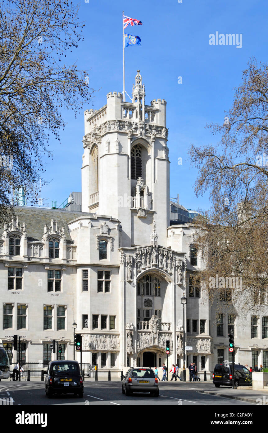 Union Jack & Emblem UKSC flags flying above stone tower old Middlesex ...