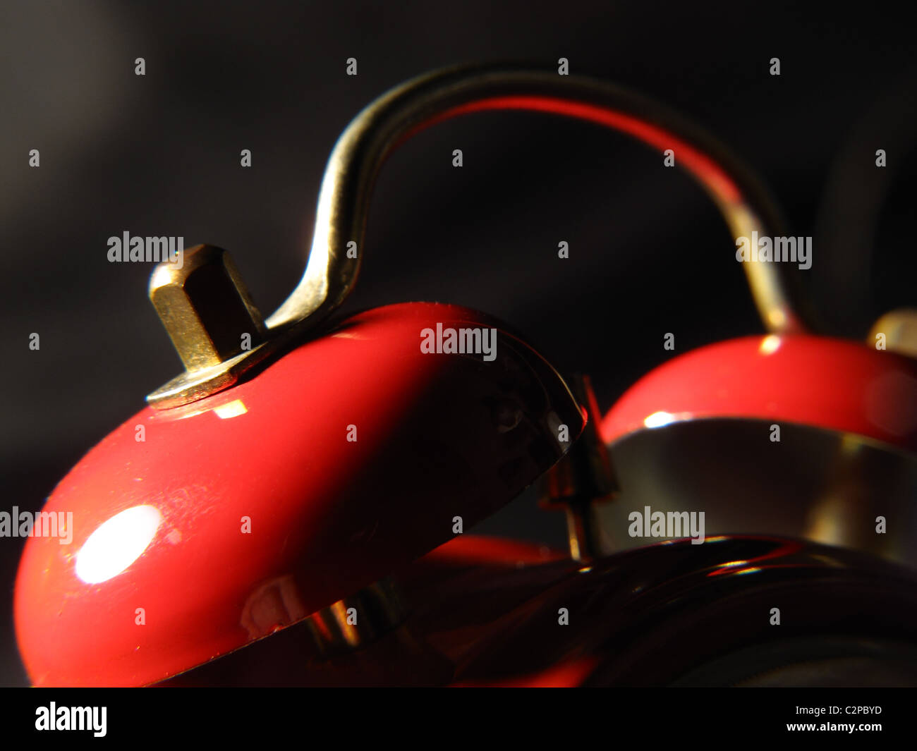 Bells of a former clock alarm clock in red color and black bottom Stock ...