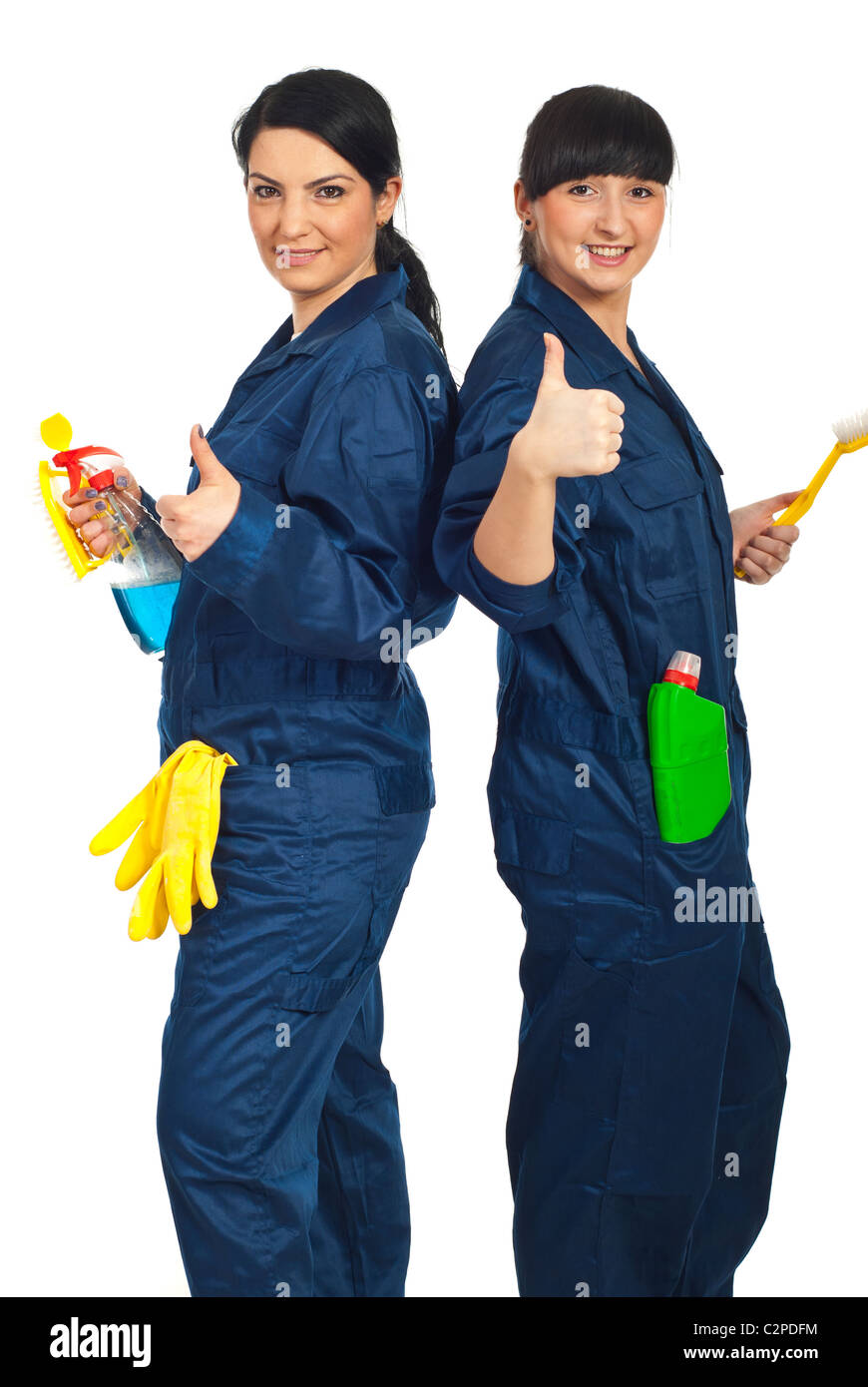 Successful two cleaning workers women giving thumbs up isolated on ...