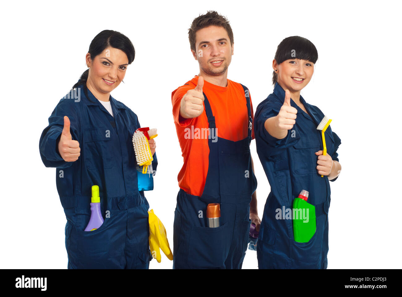 Cleaning workers in a row holding cleaning products and giving thumbs ...