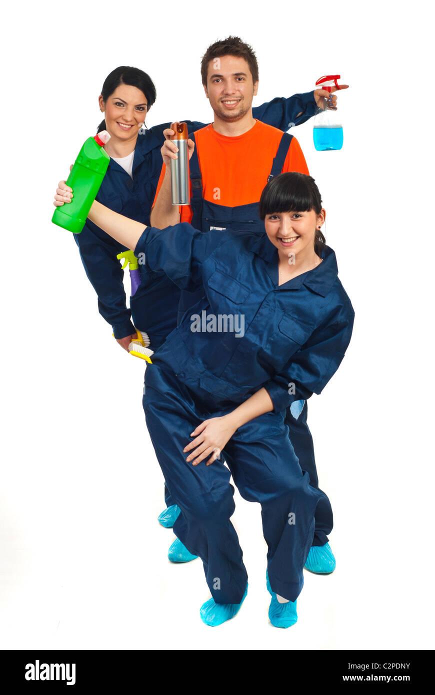Cheerful workers teamwork showing cleaning products isolated on white ...