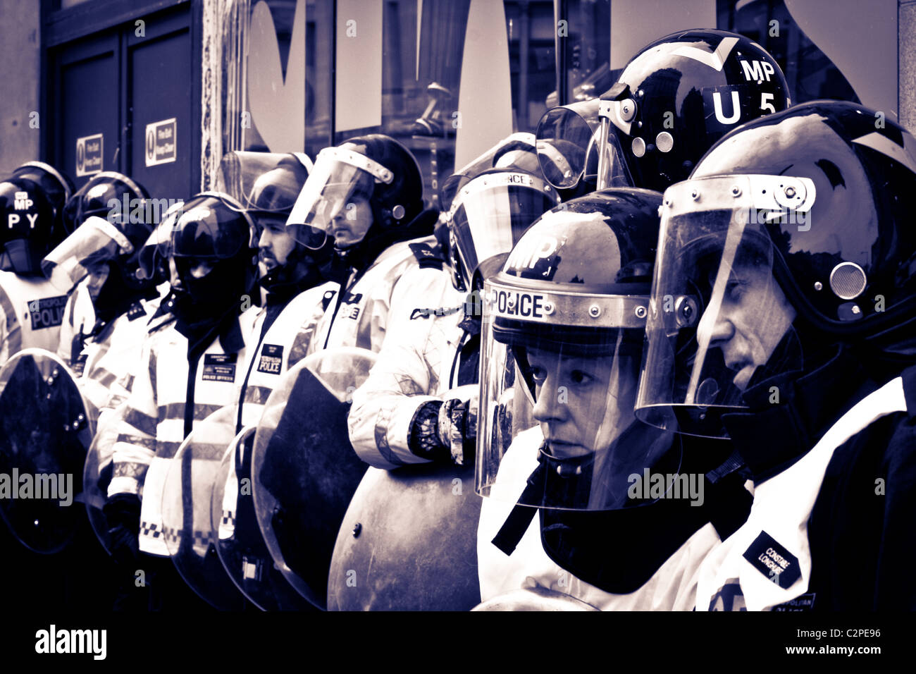 Riot police stand guard outside Topshop during TUC / UK Uncut ...