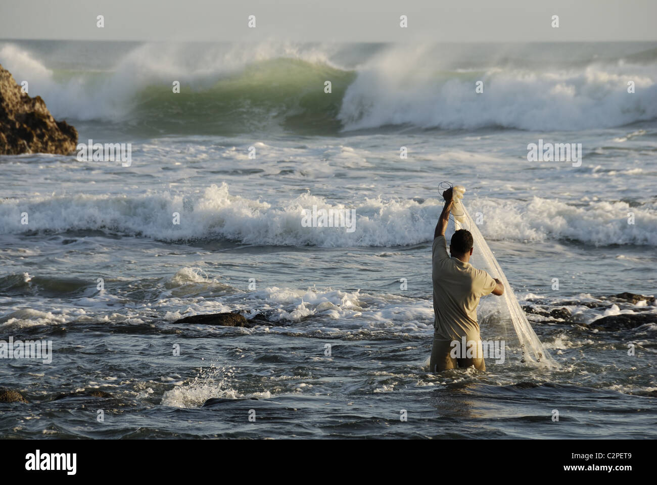 Fishing with cast net - Bali, Indonesia Stock Photo - Alamy