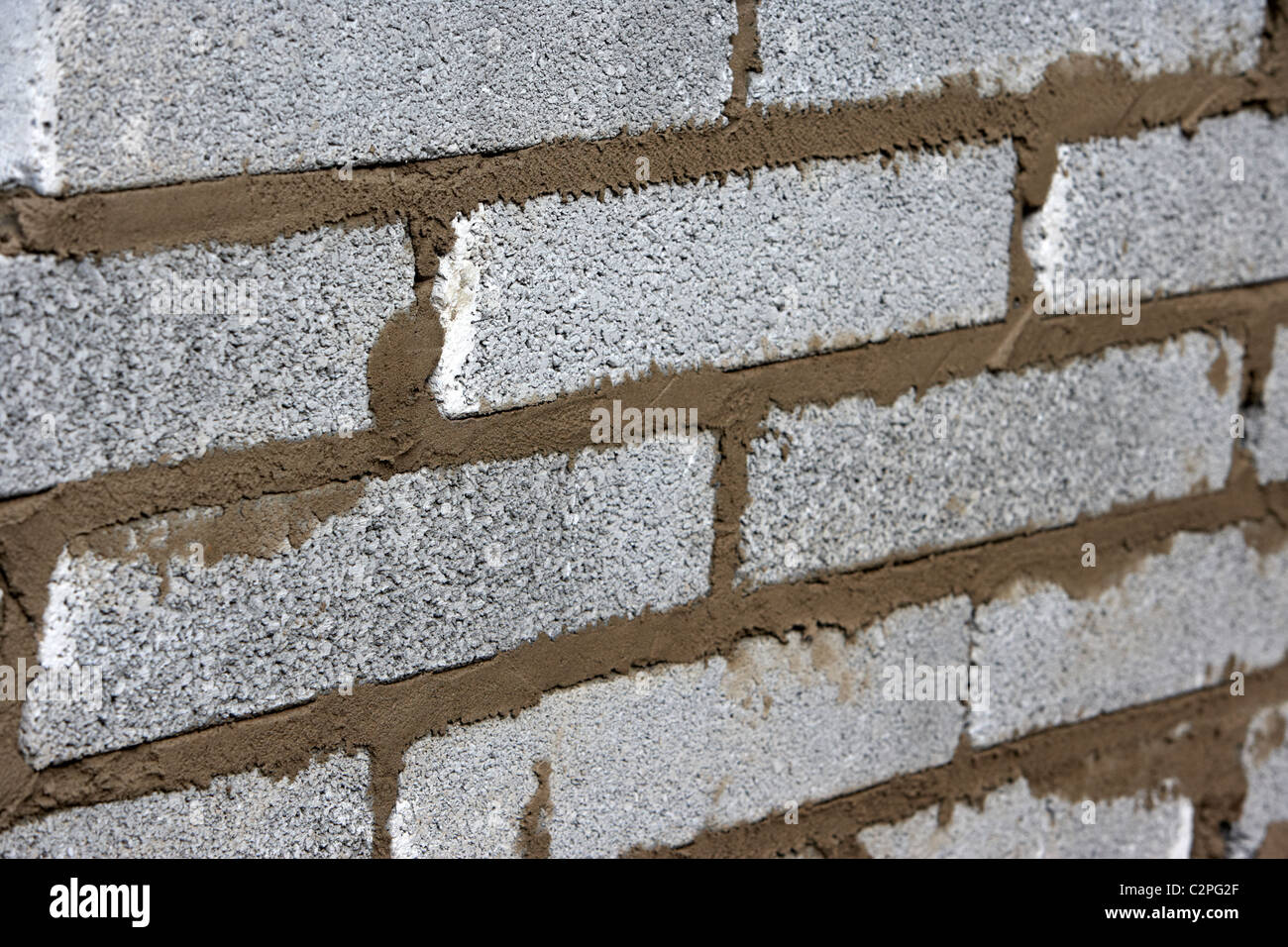 bricklaying wall with half cement breeze blocks building a block ...