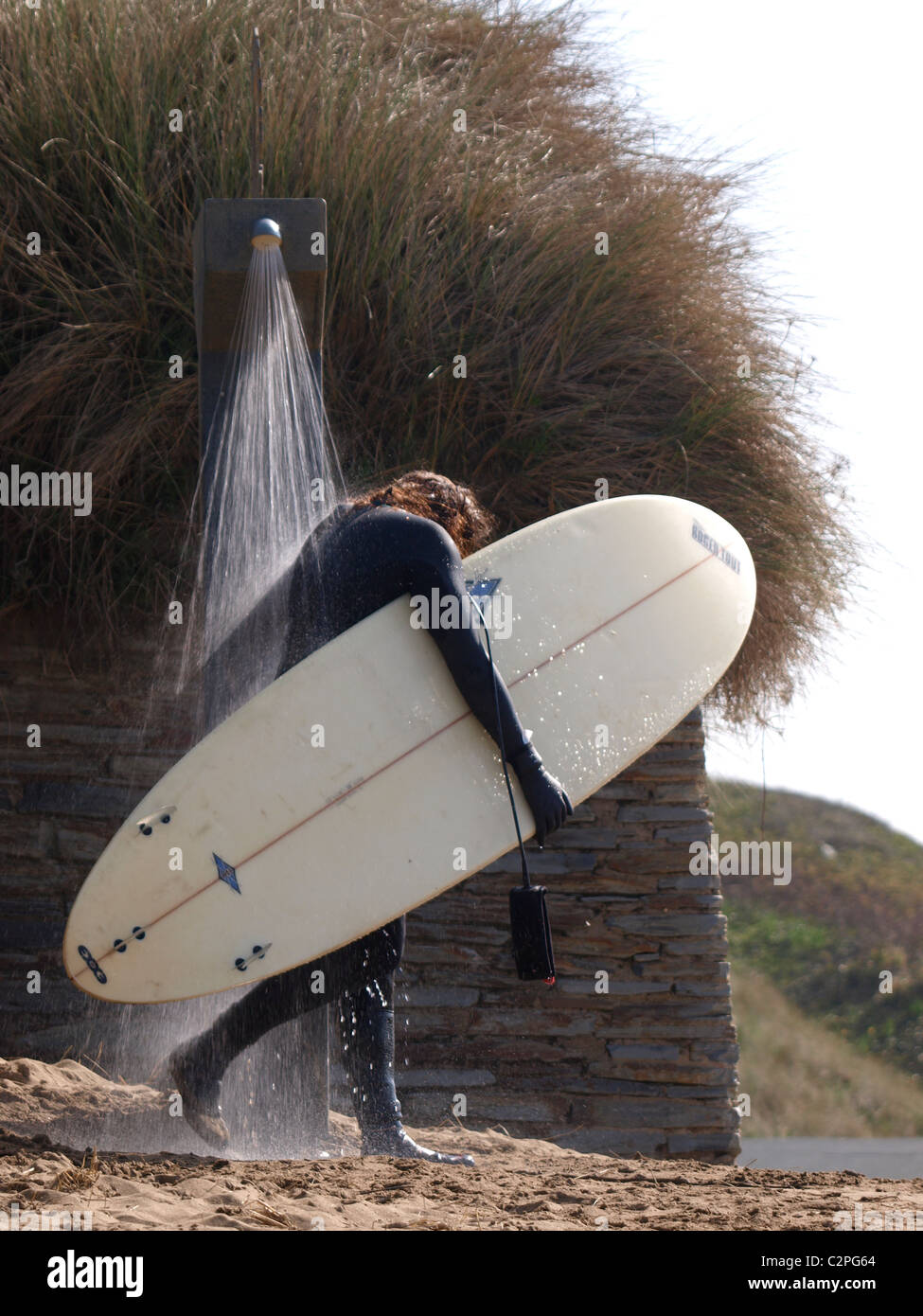 Surfer washing surfboard hi-res stock photography and images - Alamy
