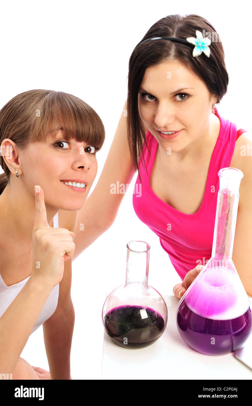 Two women conducting a chemical experiment Stock Photo - Alamy