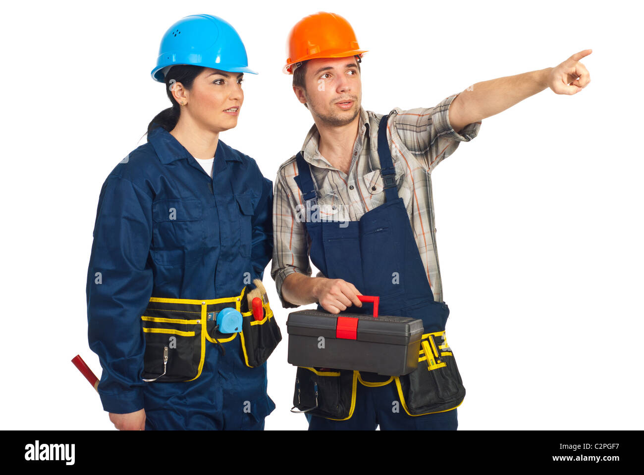 Builder man pointing away and showing something to his colleague woman ...