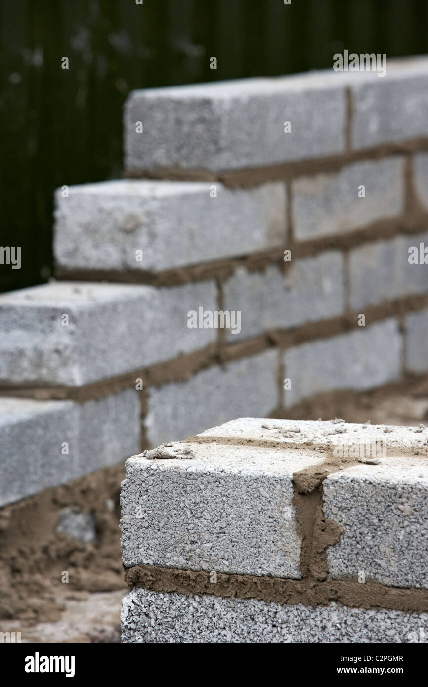 partially built wall with half cement breeze blocks building a block ...