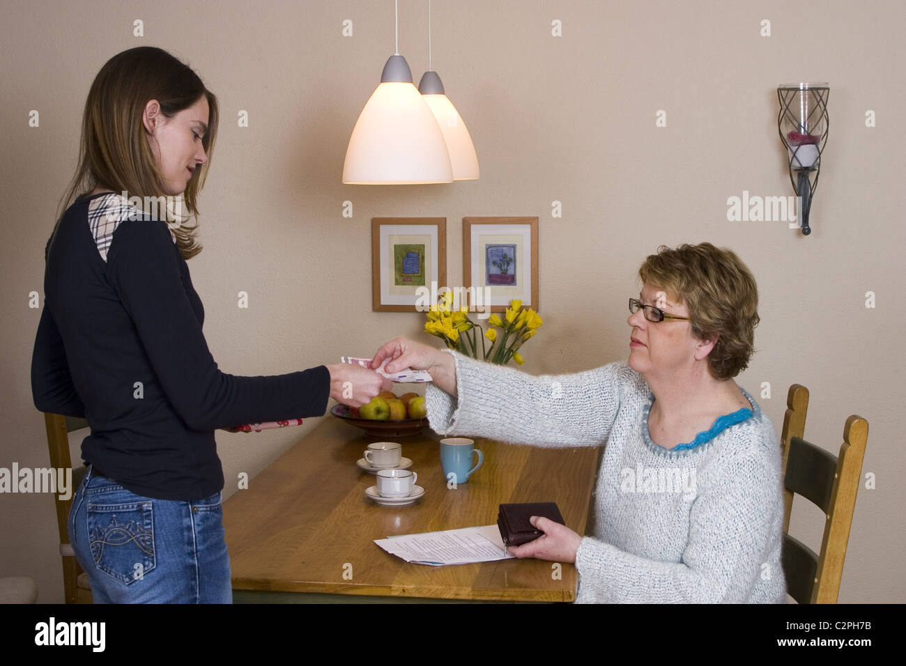 Parent giving money to young adult hi-res stock photography and images ...
