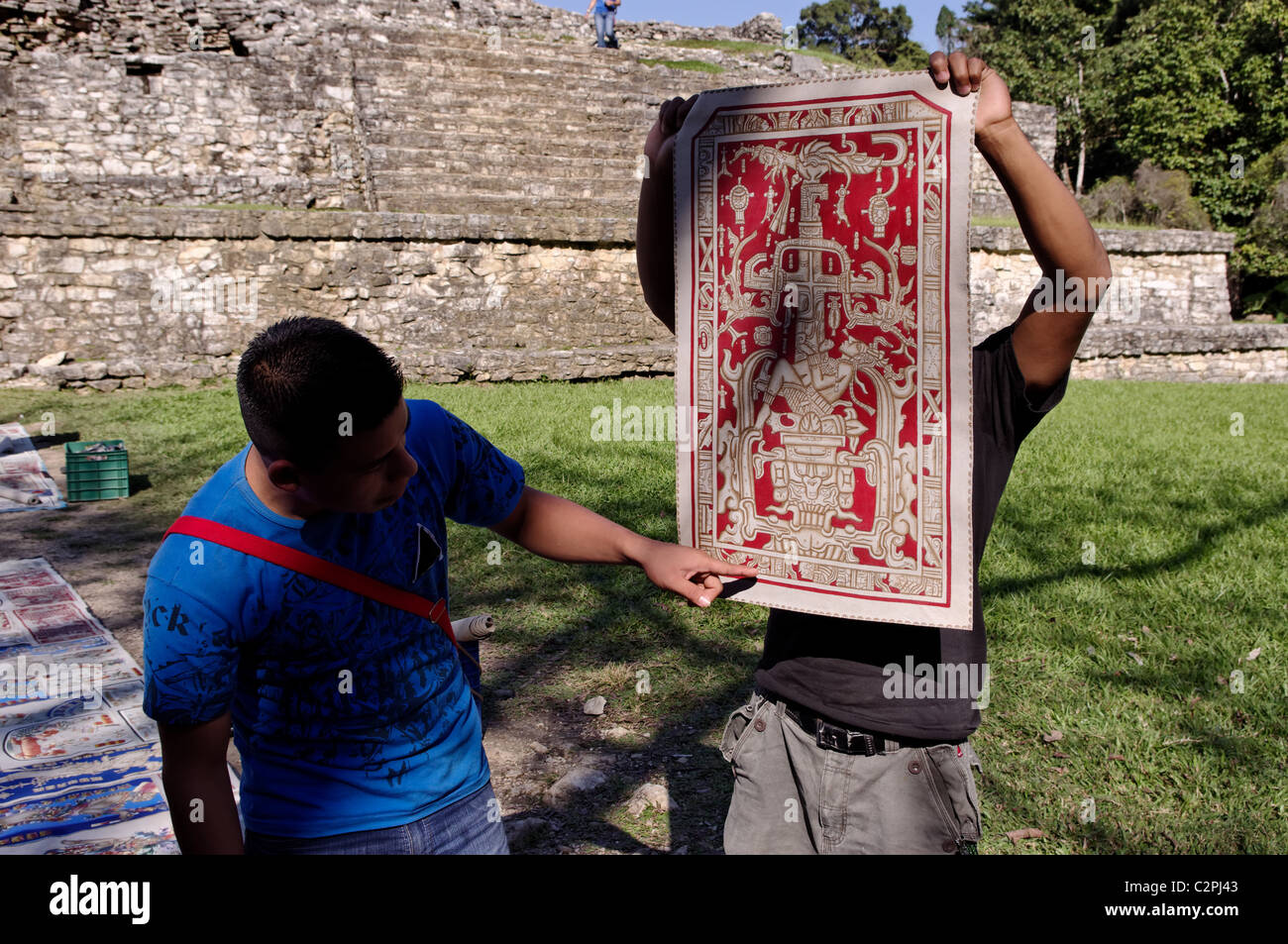 Mayan guide explaining a drawing of Pakal tomb to tourists in Palenque ...