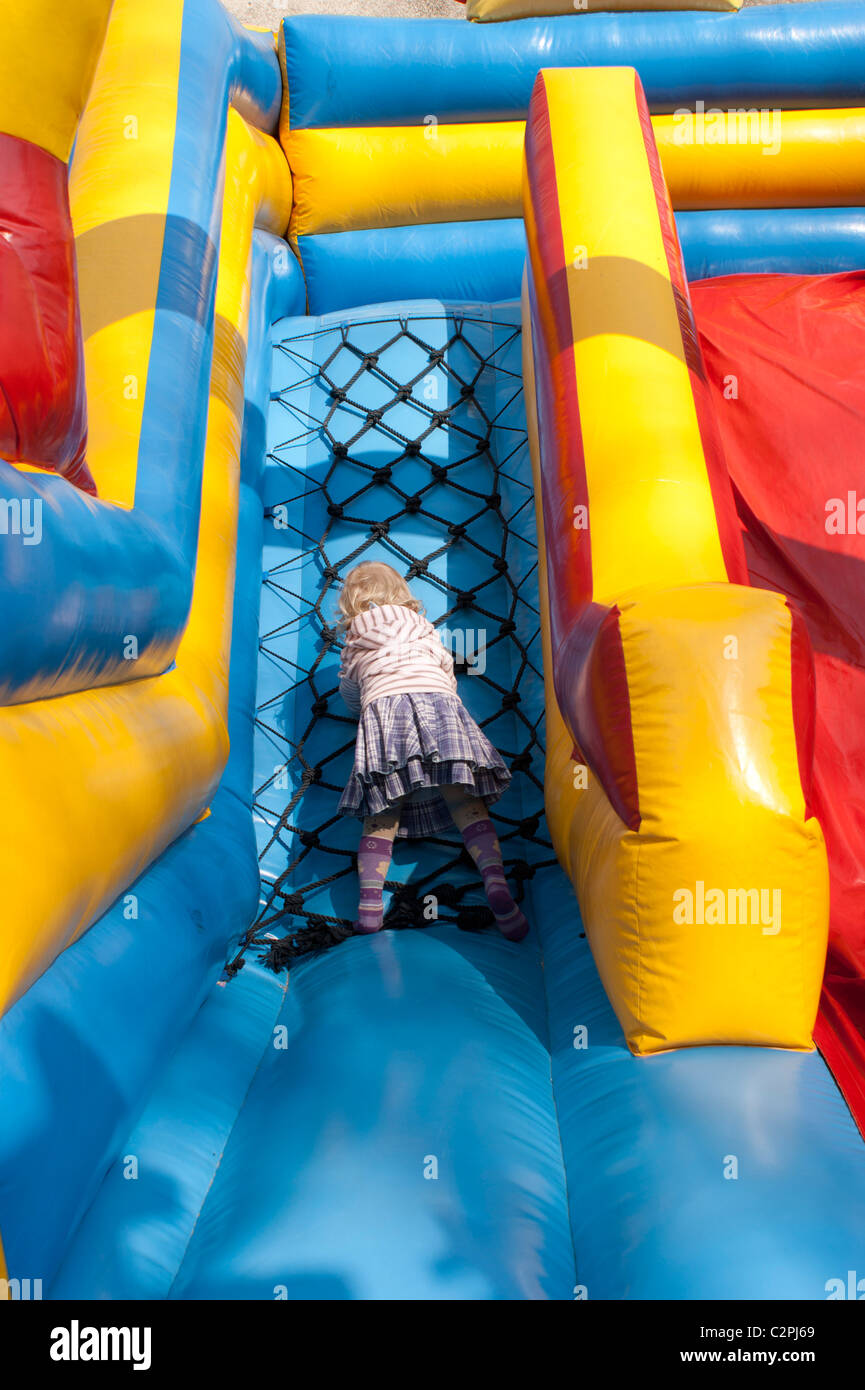 Children playing on inflatable slide hi-res stock photography and ...