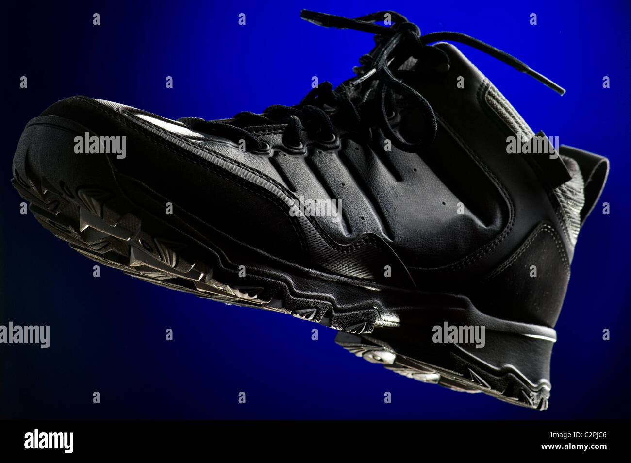 object on blue - Men sports winter boots Stock Photo - Alamy