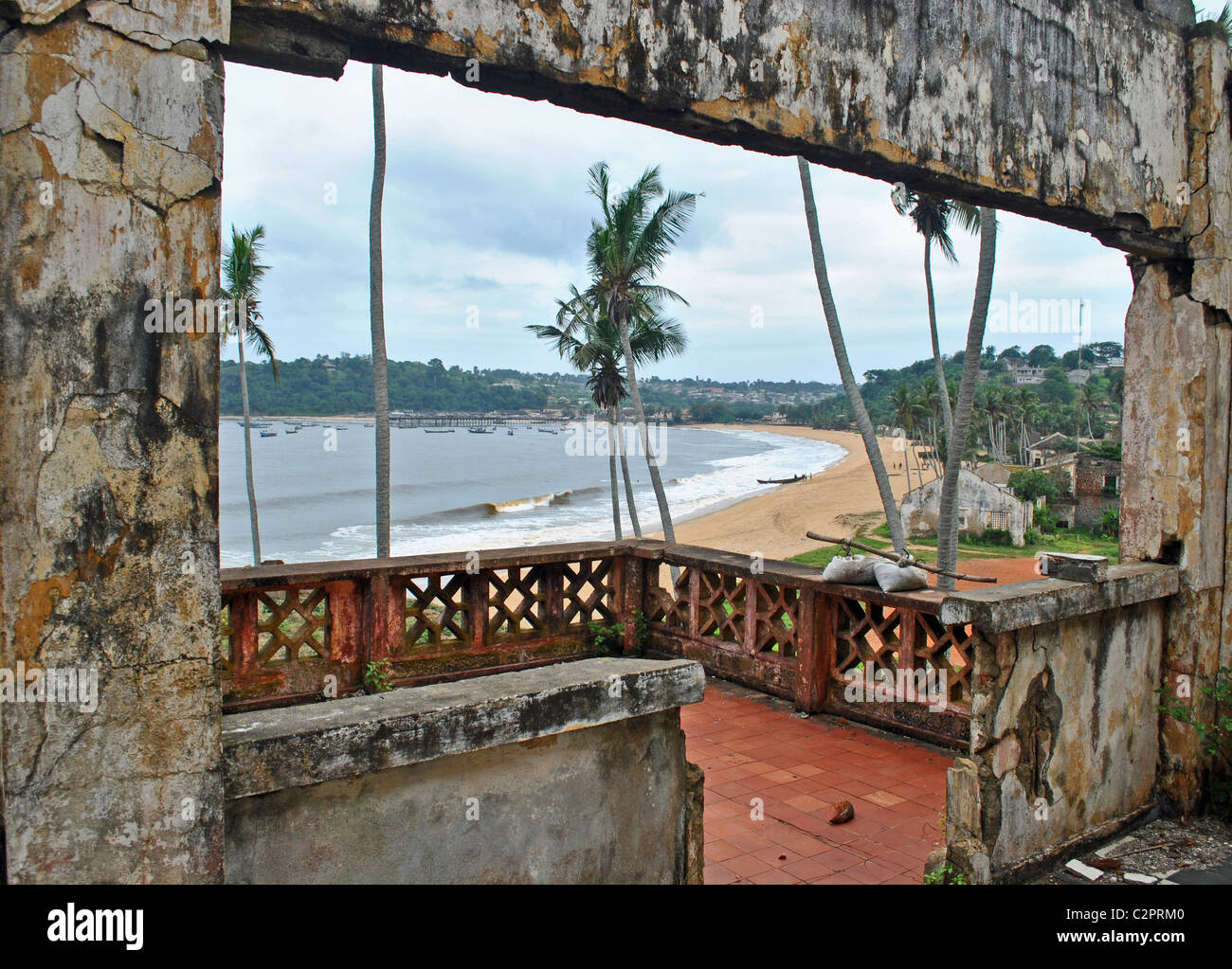 Derelict colonial building overlooking Sassandra Beach, Ivory Coast ...
