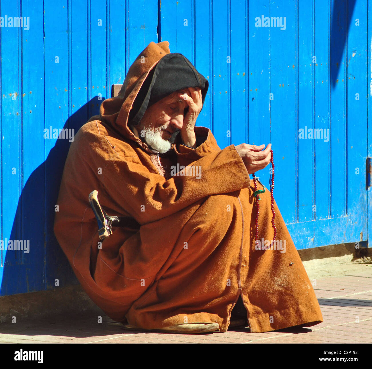 Elderly man begging in Morocco Stock Photo - Alamy