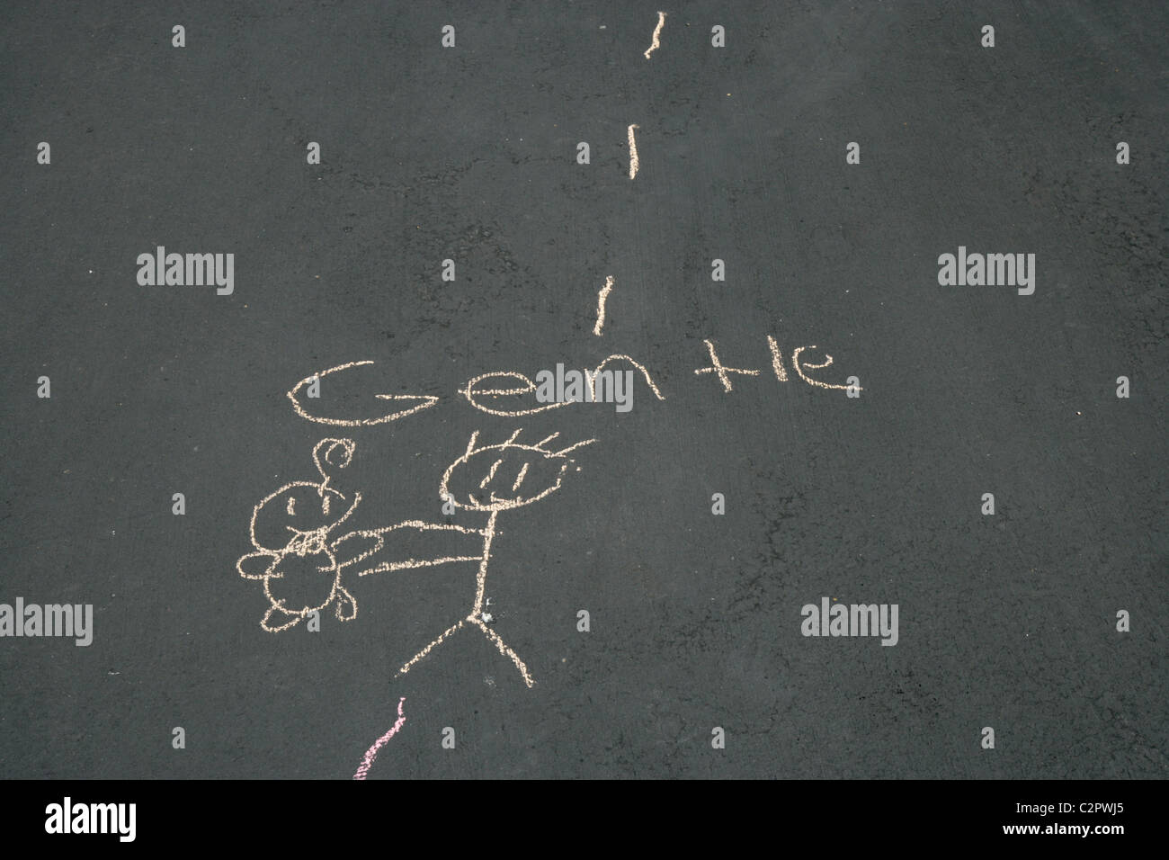 Chalk drawing by seven year old girl on blacktop hi-res stock ...