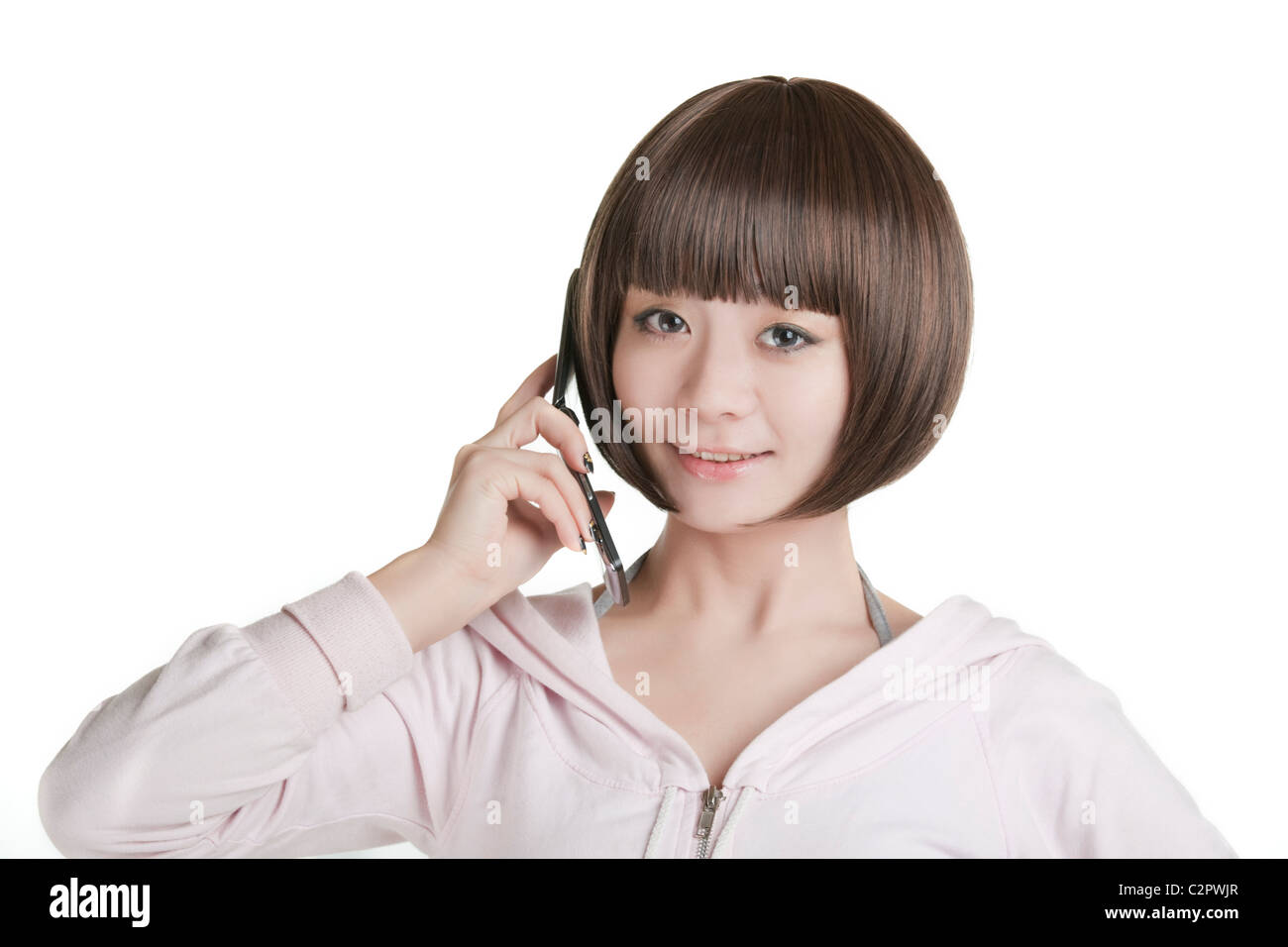 Beautiful Chinese woman using a cell phone on a white background Stock ...
