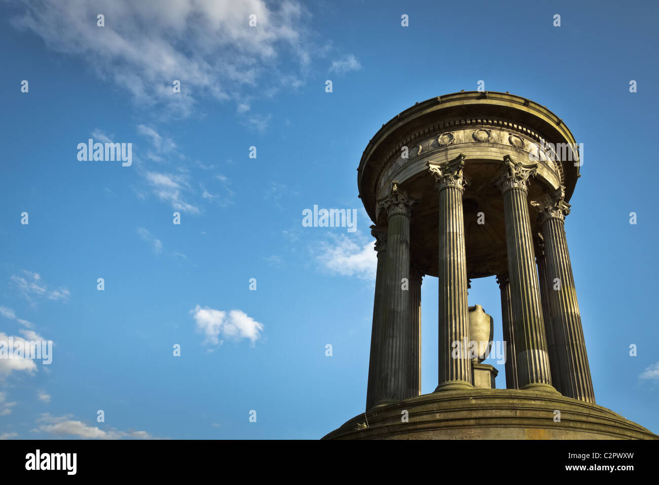 Greek columns monument on bluesky background Stock Photo - Alamy
