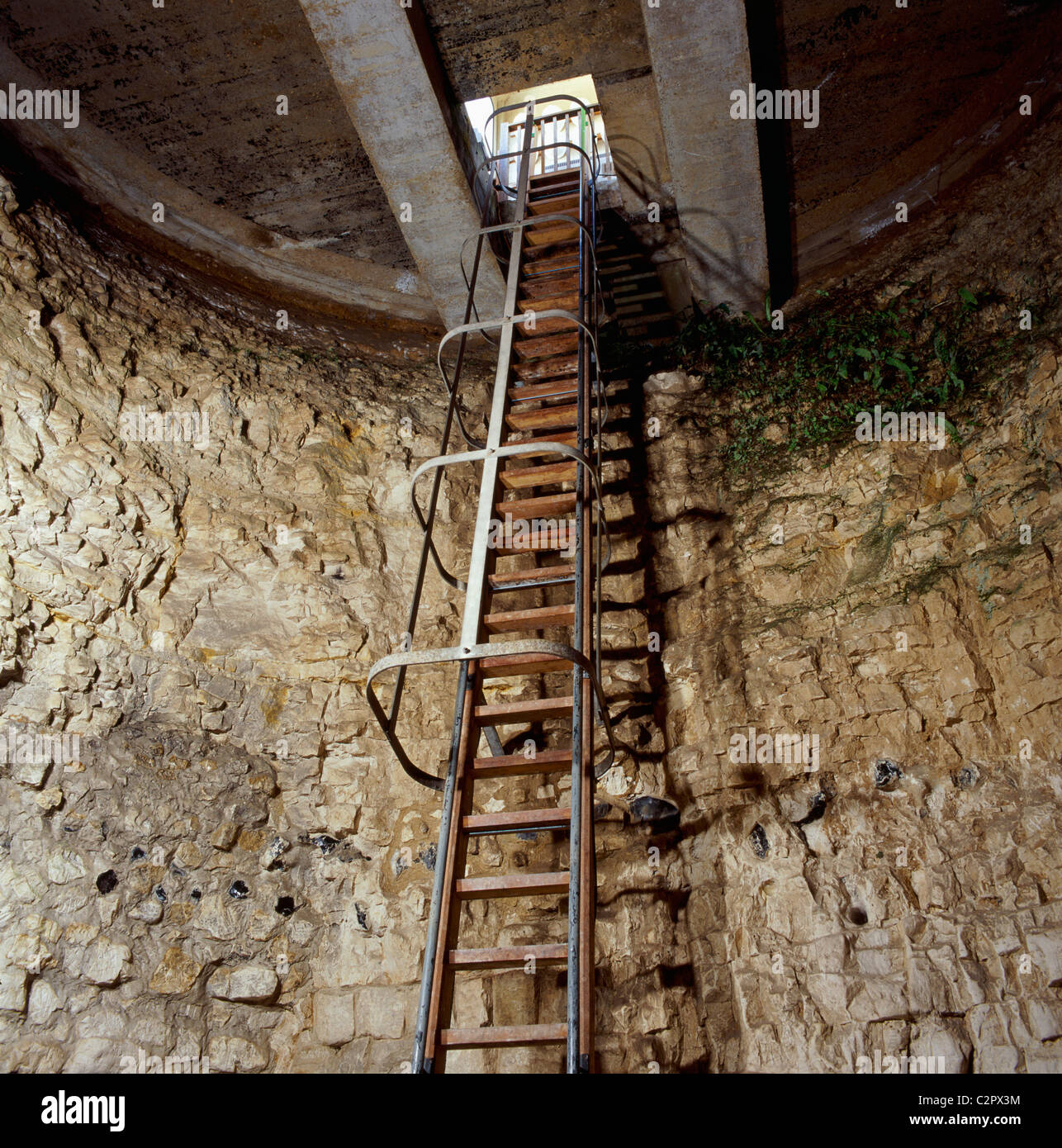 Grimes Graves. Neolithic flint mine. View of ladder down mine shaft ...