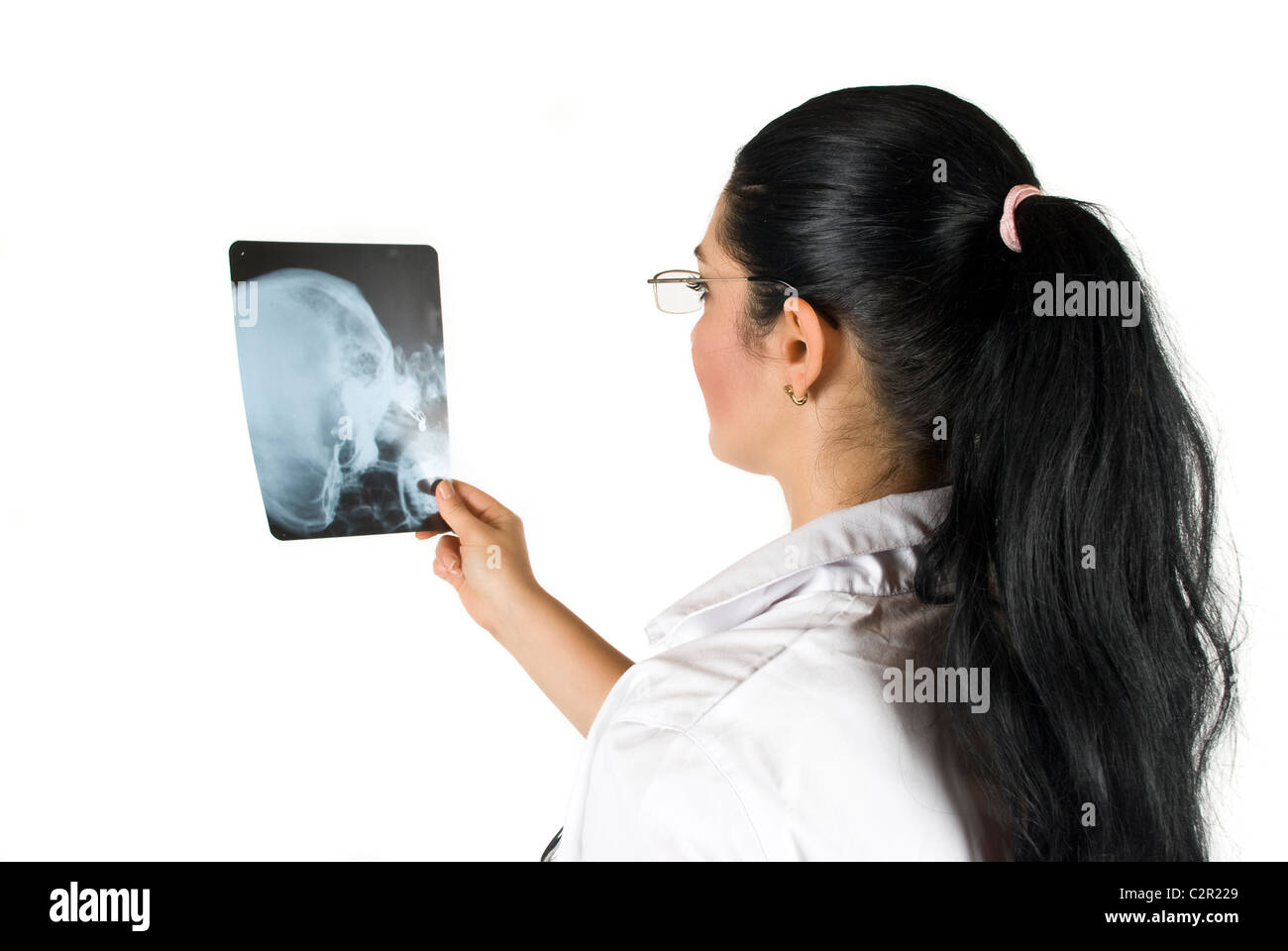 Doctor examine a head X-ray on white background Stock Photo - Alamy
