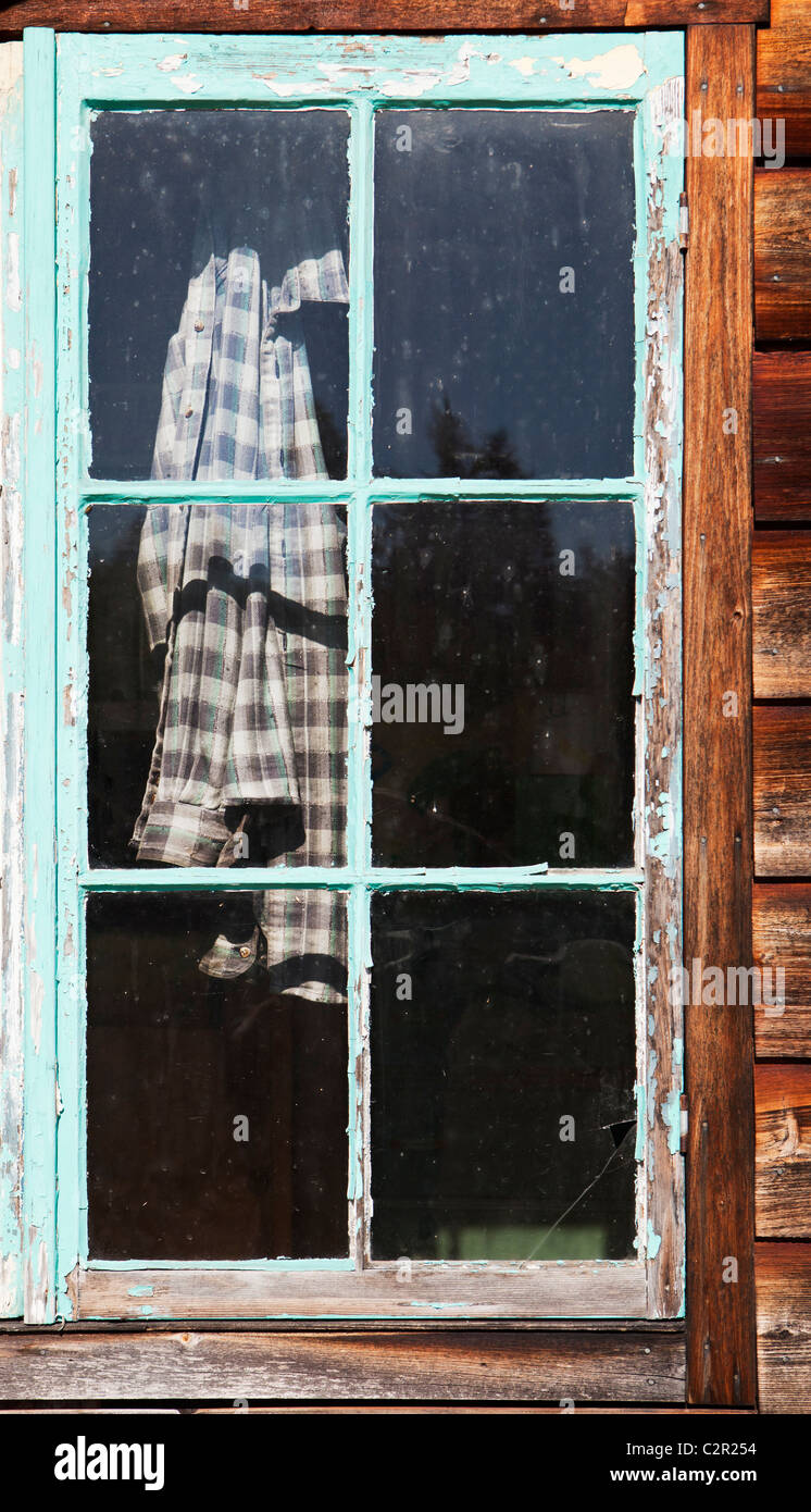 Plaid Shirt In Window Stock Photo - Alamy