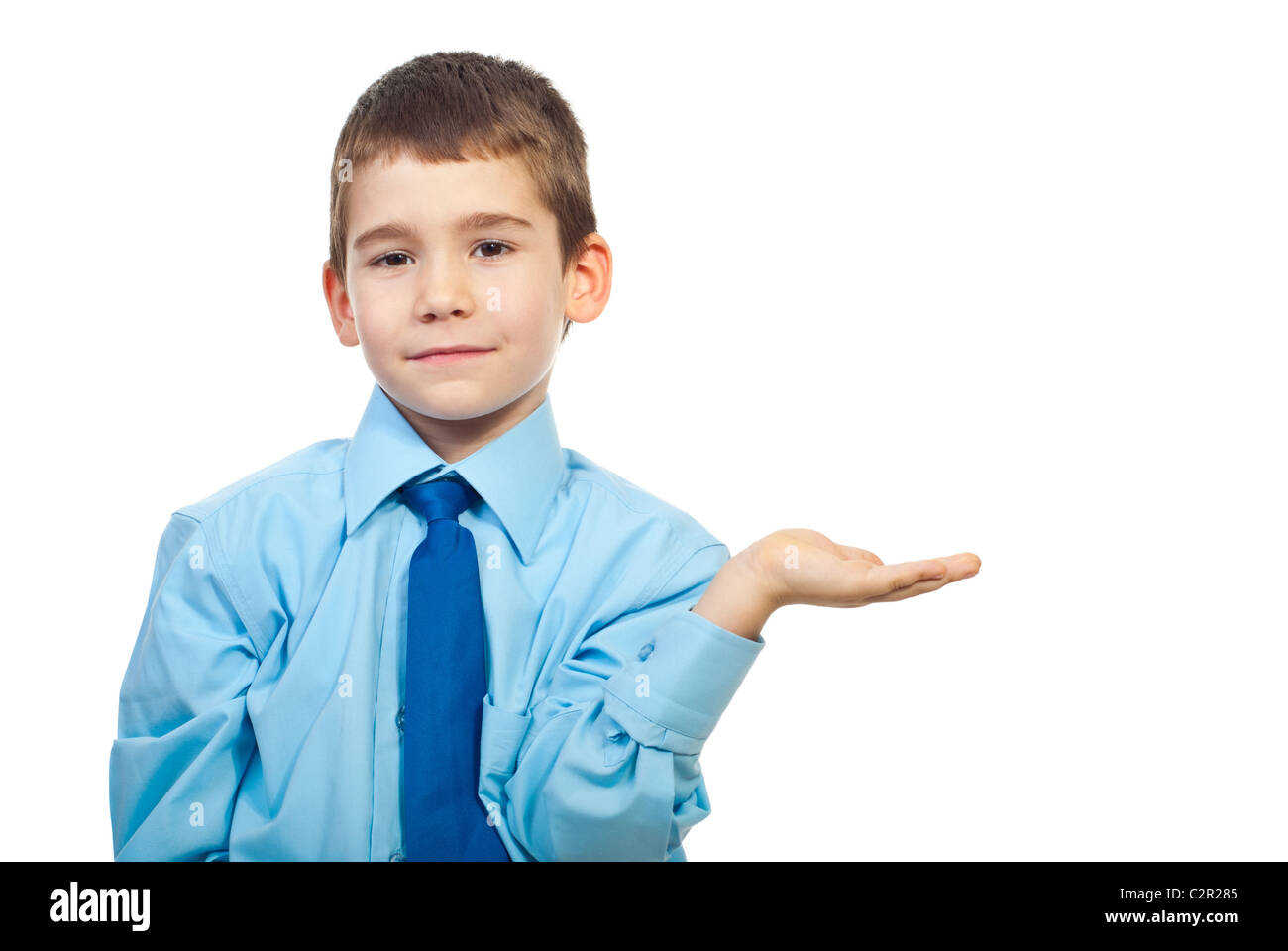 Preschooler boy standing with palm open and making presentation ...