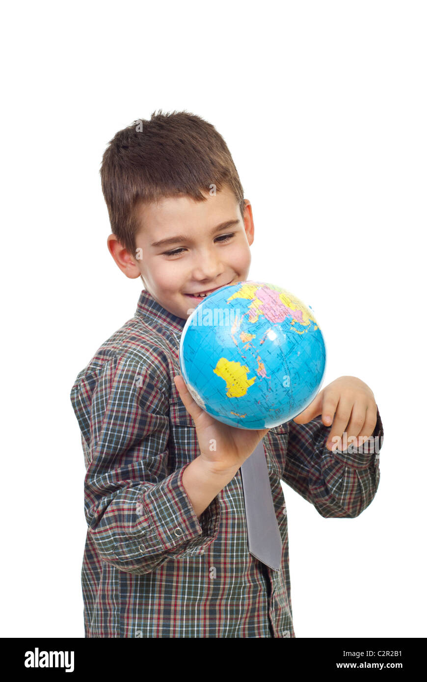 Laughing preschool boy playing with a globe isolated on white ...
