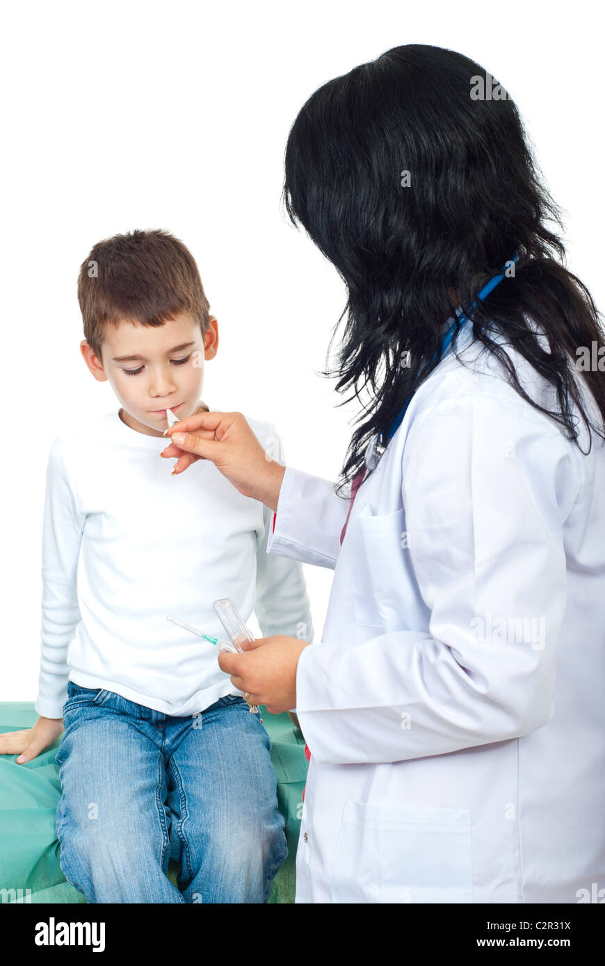 Doctor checking temperature to a small child isolated on white ...