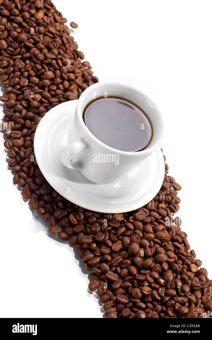 Cup with coffee, costing on coffee grain Stock Photo - Alamy