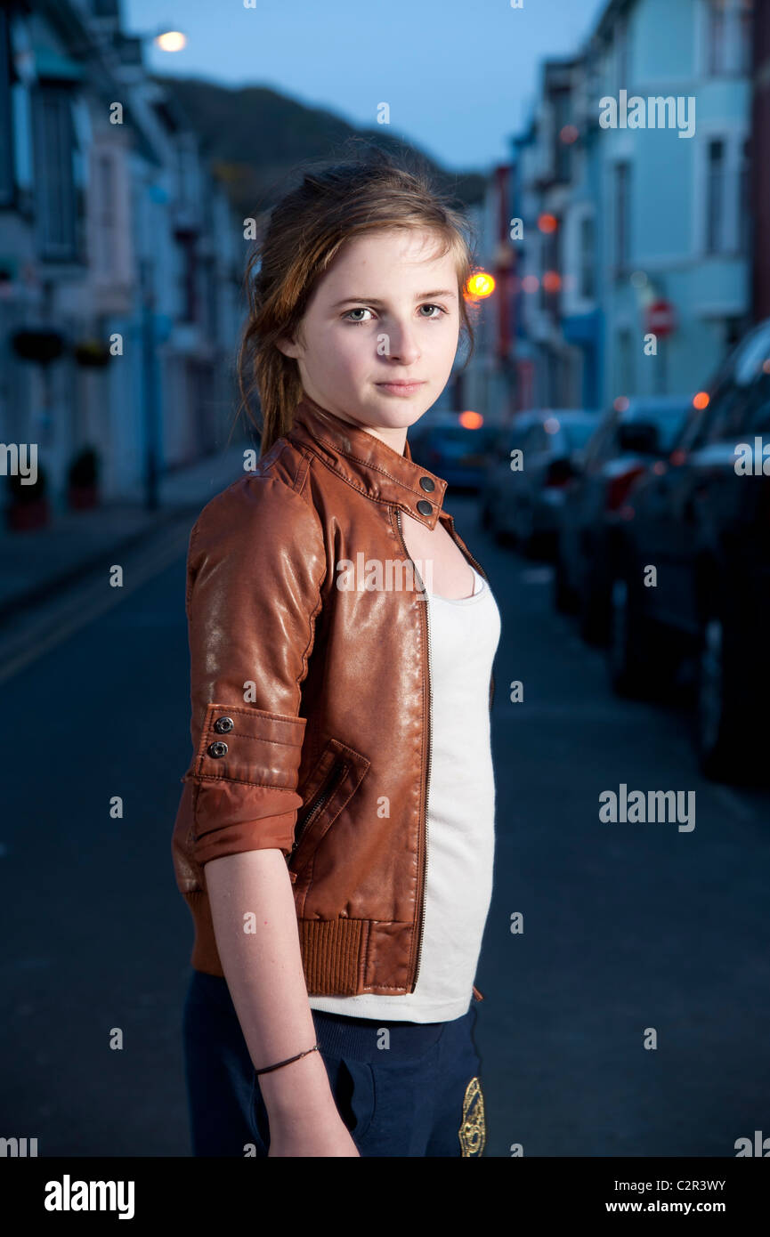 a twelve year old teenage girl outside on the street at night UK Stock ...