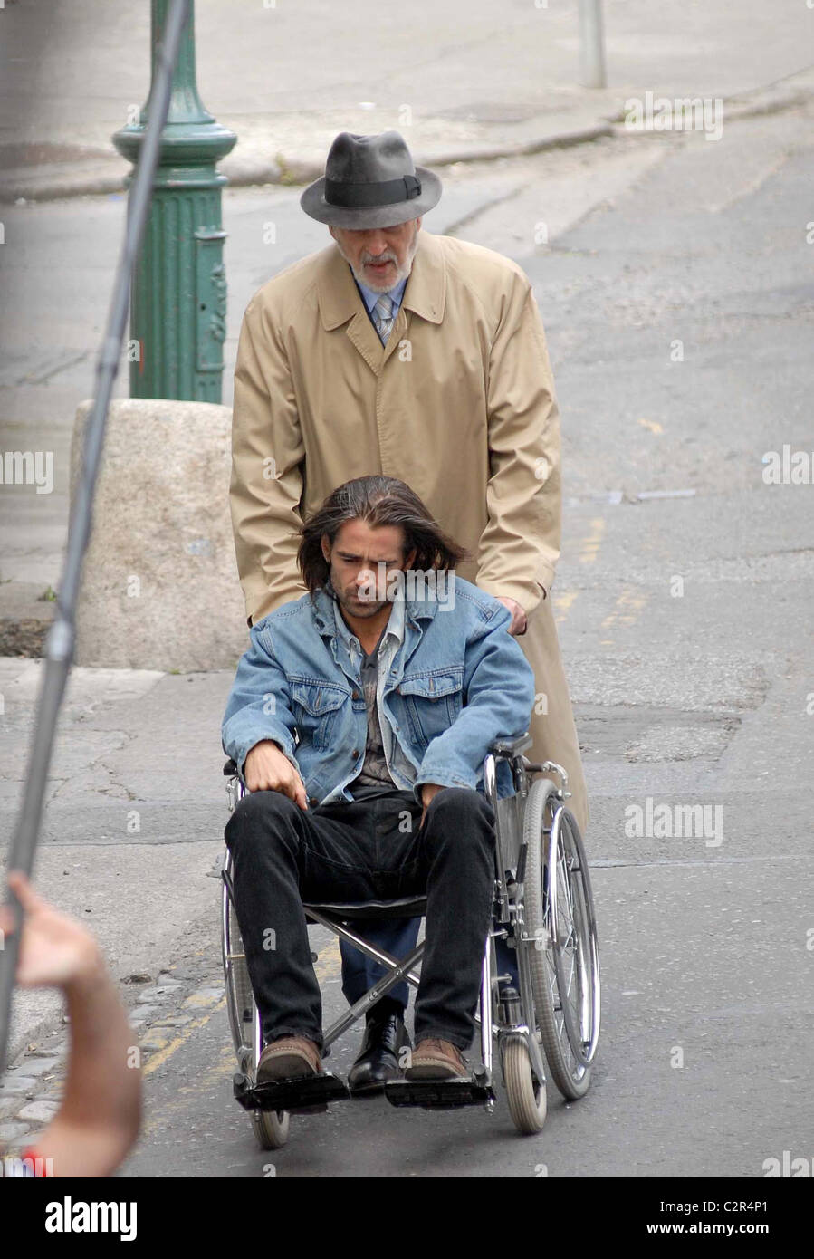 Christopher Lee pushes Colin Farrell in a wheelchair on the set of ...