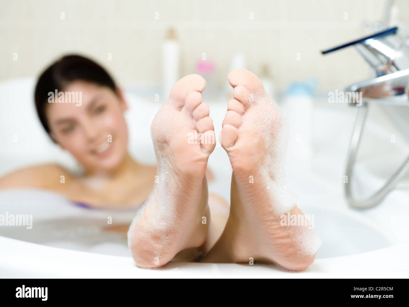 Image of soles of woman having pleasant bath with foam Stock Photo - Alamy