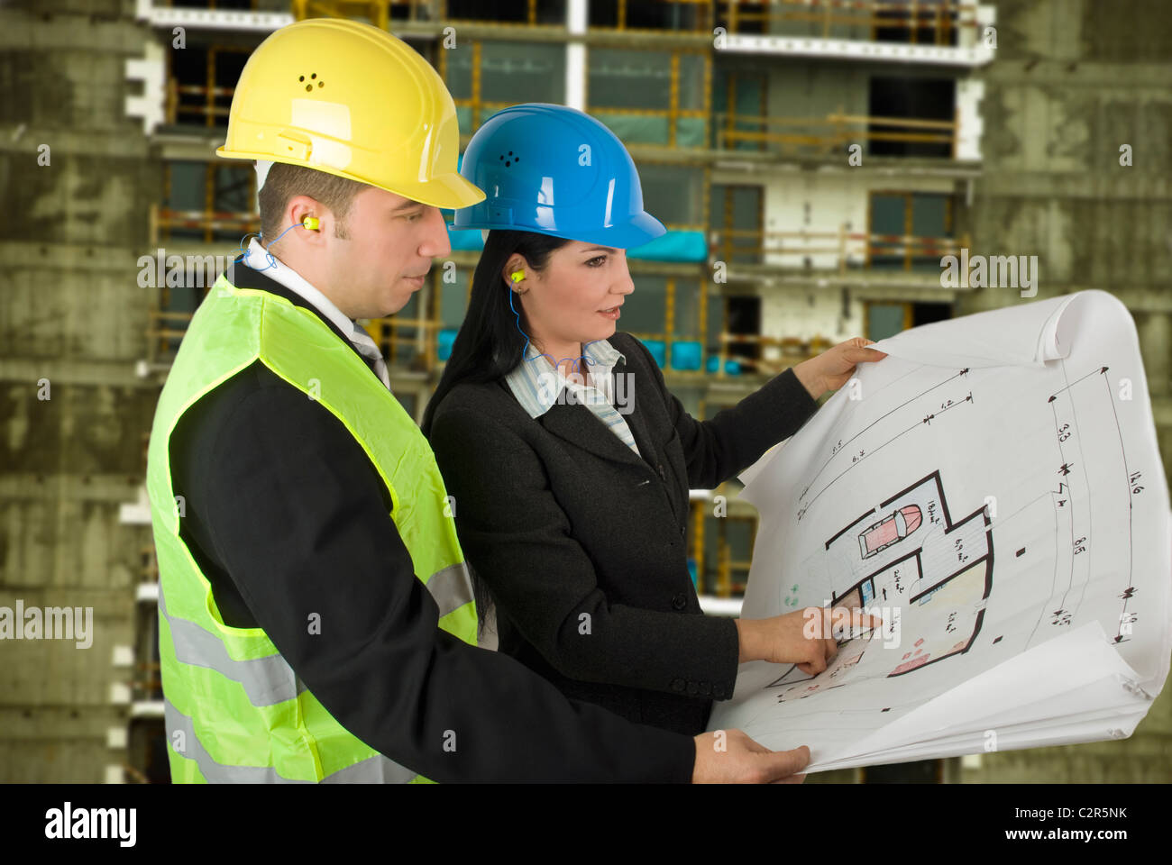 Engineer and client looking on project on the construction site Stock ...