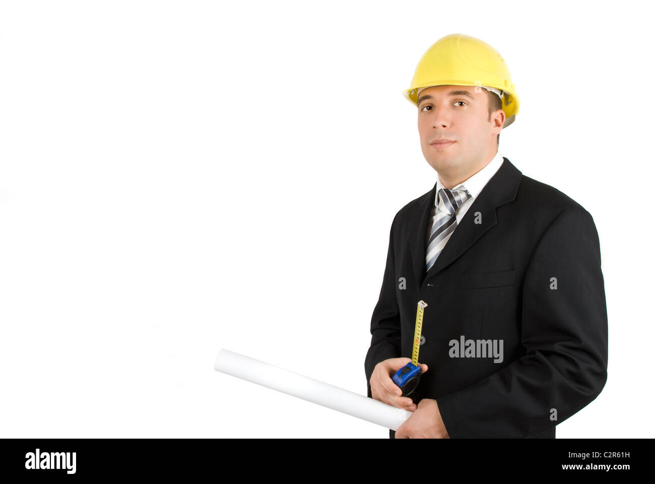 Young man engineer with yellow hardhat,ruler and project isolated on ...