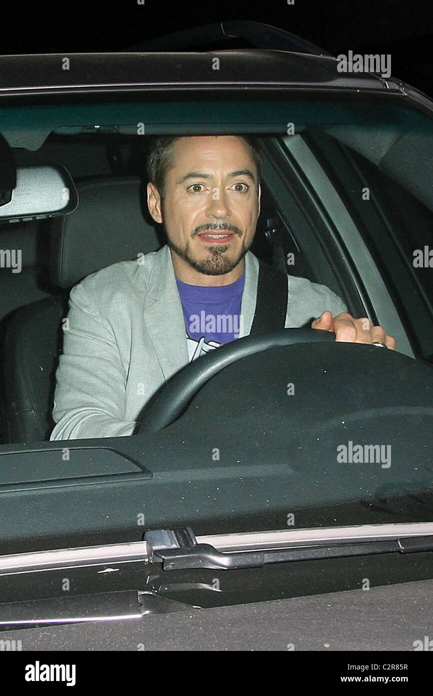 Robert Downey Jr signs autographs while leaving Mr Chow restaurant ...