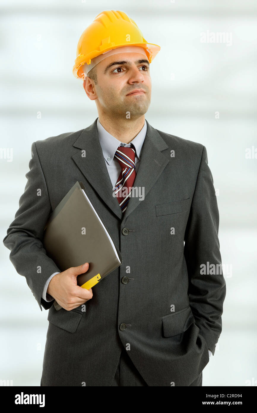 An engineer with yellow hat at the office Stock Photo - Alamy