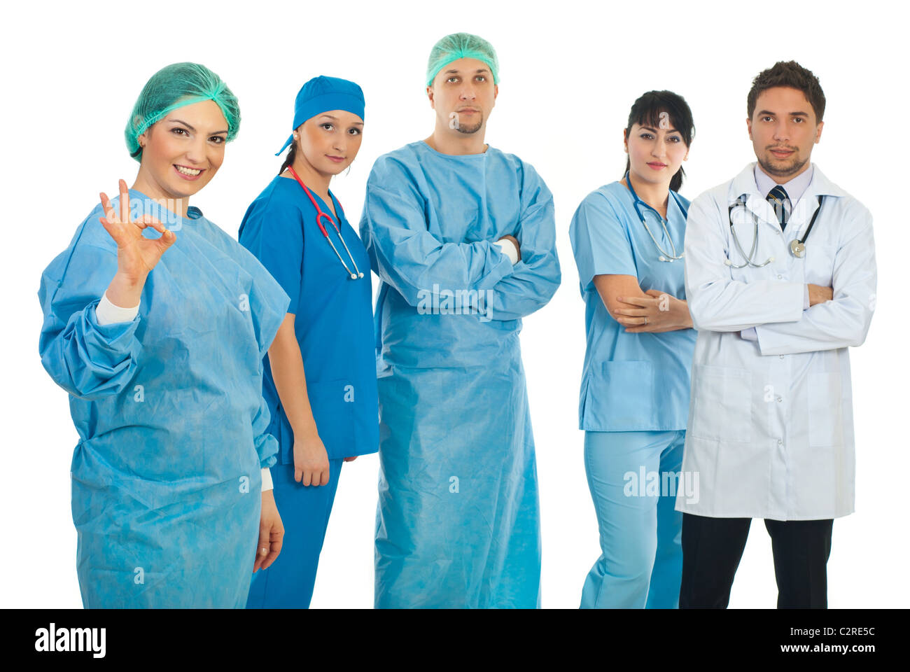 Surgeon woman giving okay sign hand gesture and her team standing with ...