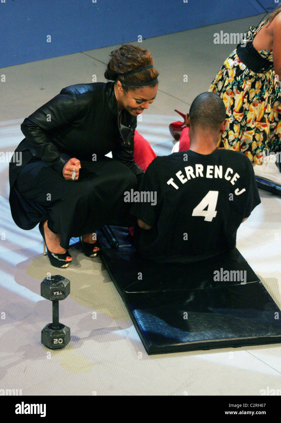 Janet Jackson teaches VJ Terrence J her exercise routine on BET's '106 ...