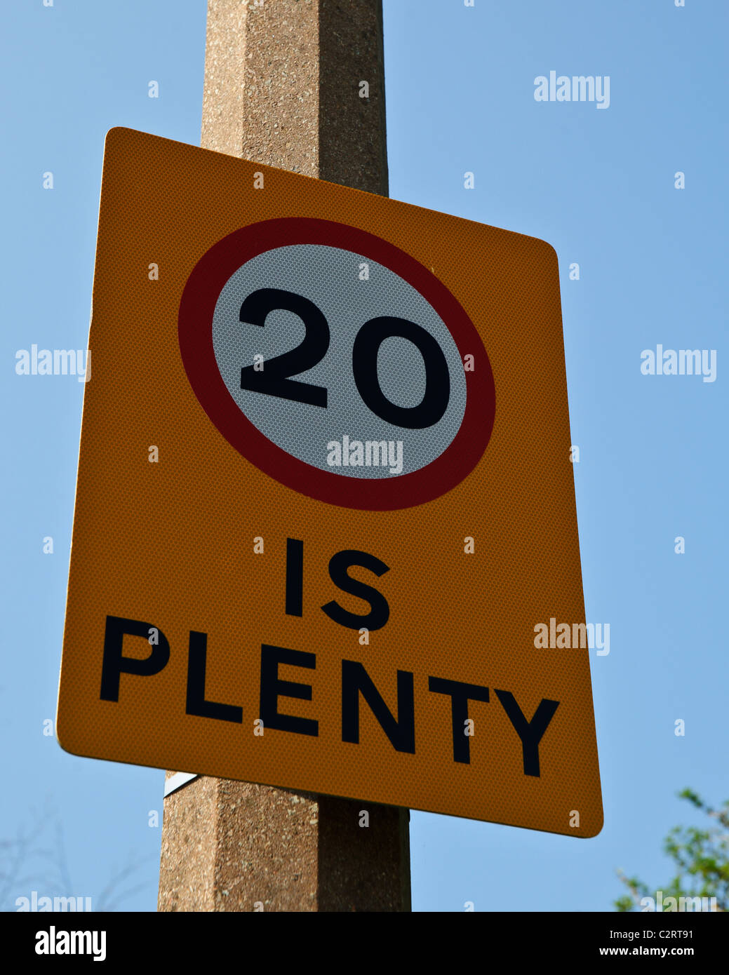 20 is plenty road speed limit sign attached to a lamp post in ...