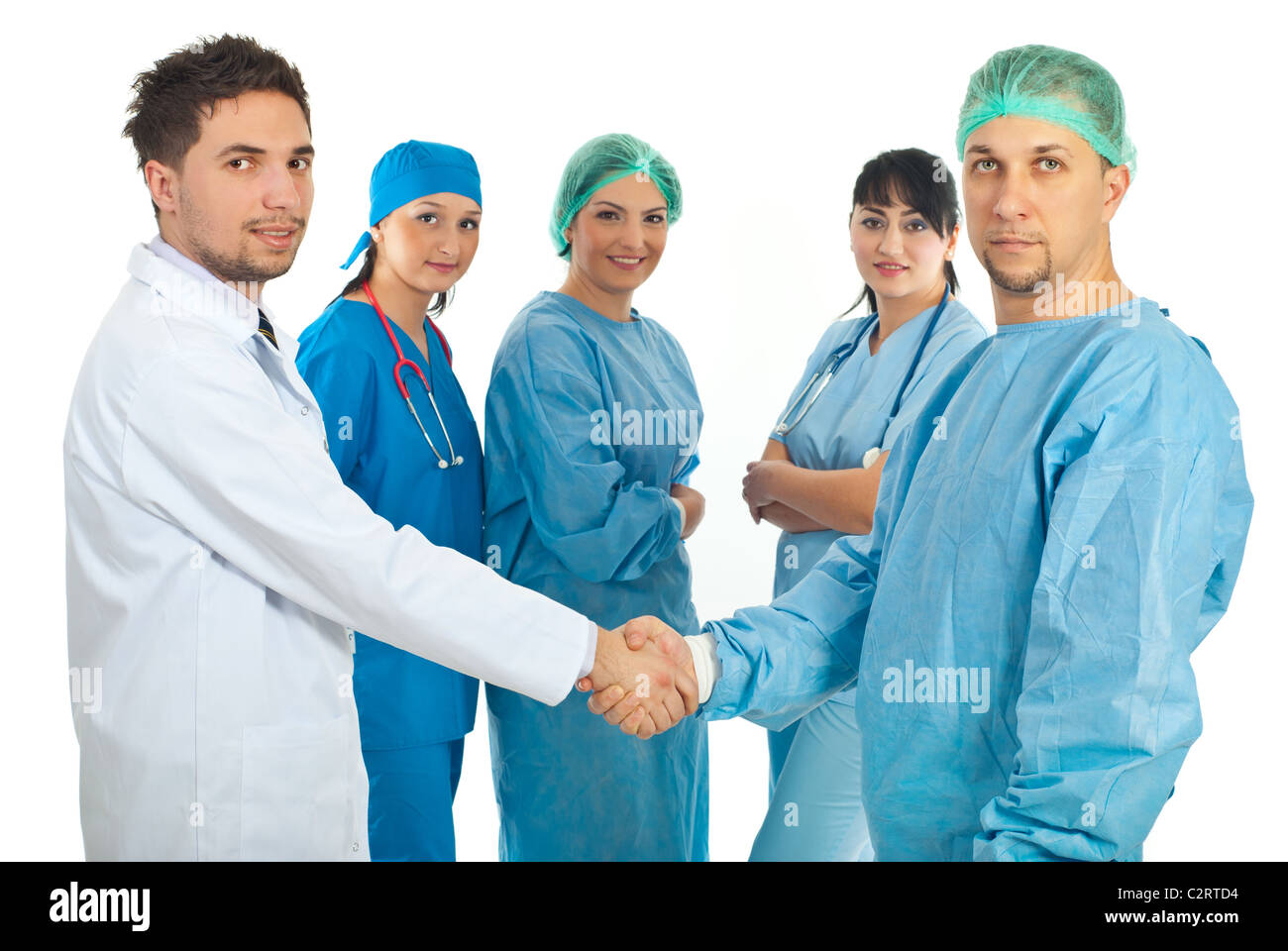 Two doctors men giving handshake in front of three doctors women team ...