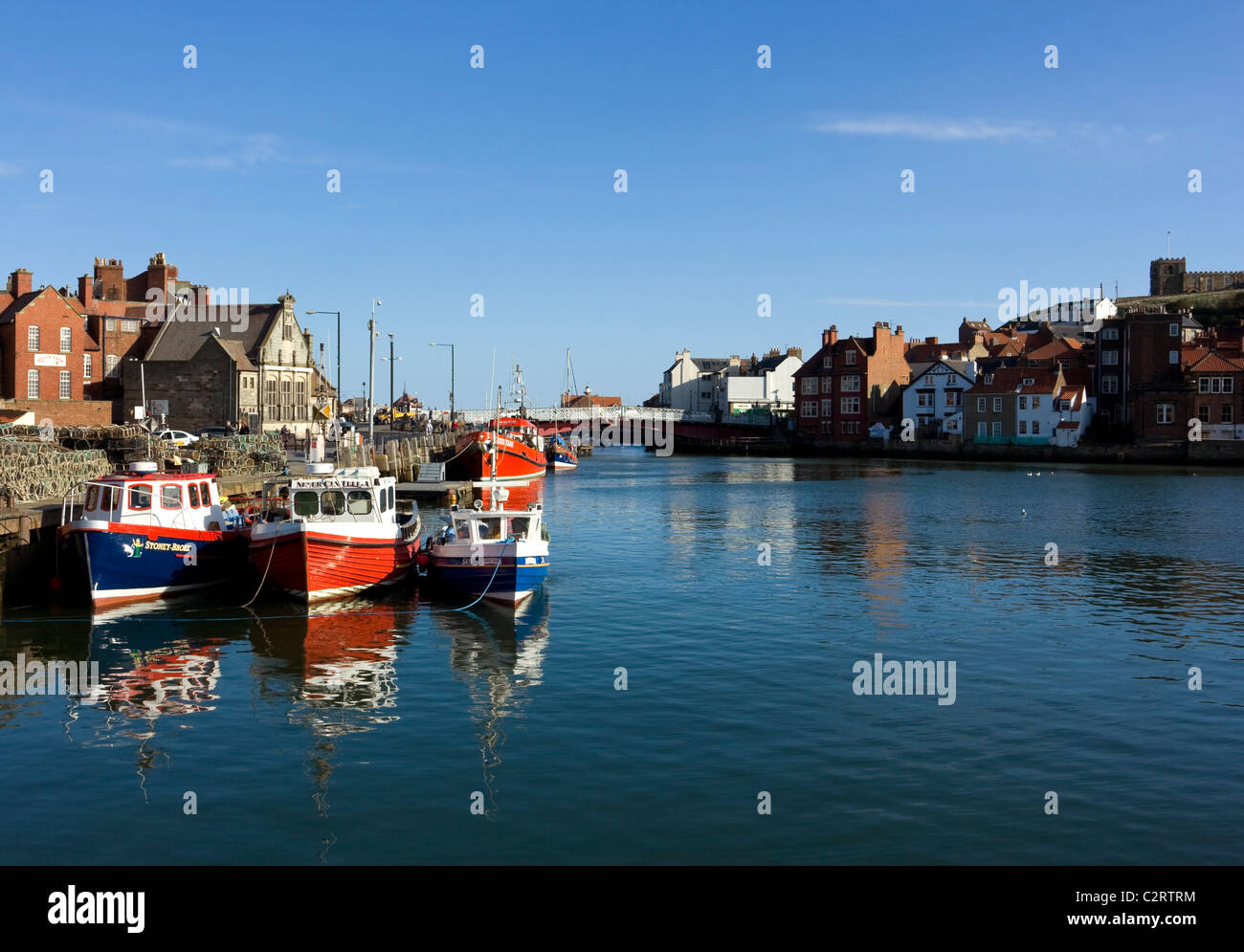 Harbour scene with fishing boats in Whitby North Yorkshire England ...