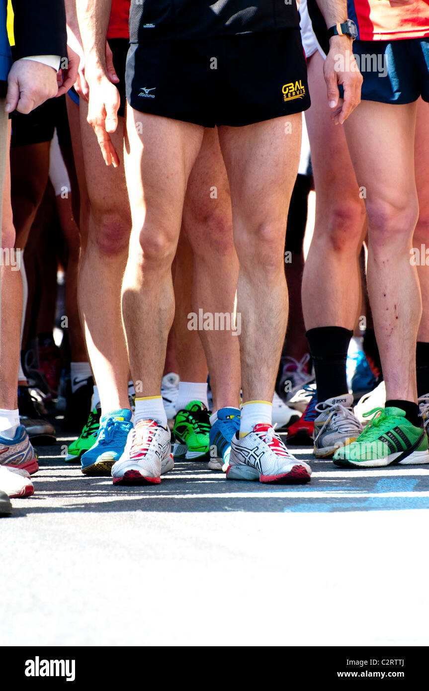 legs of marathon runners before the start of the race Stock Photo - Alamy