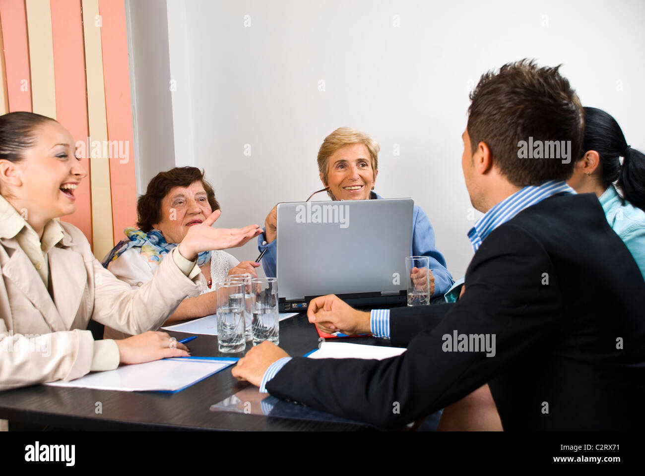 Business people having funny conversation at meeting and they smiling ...