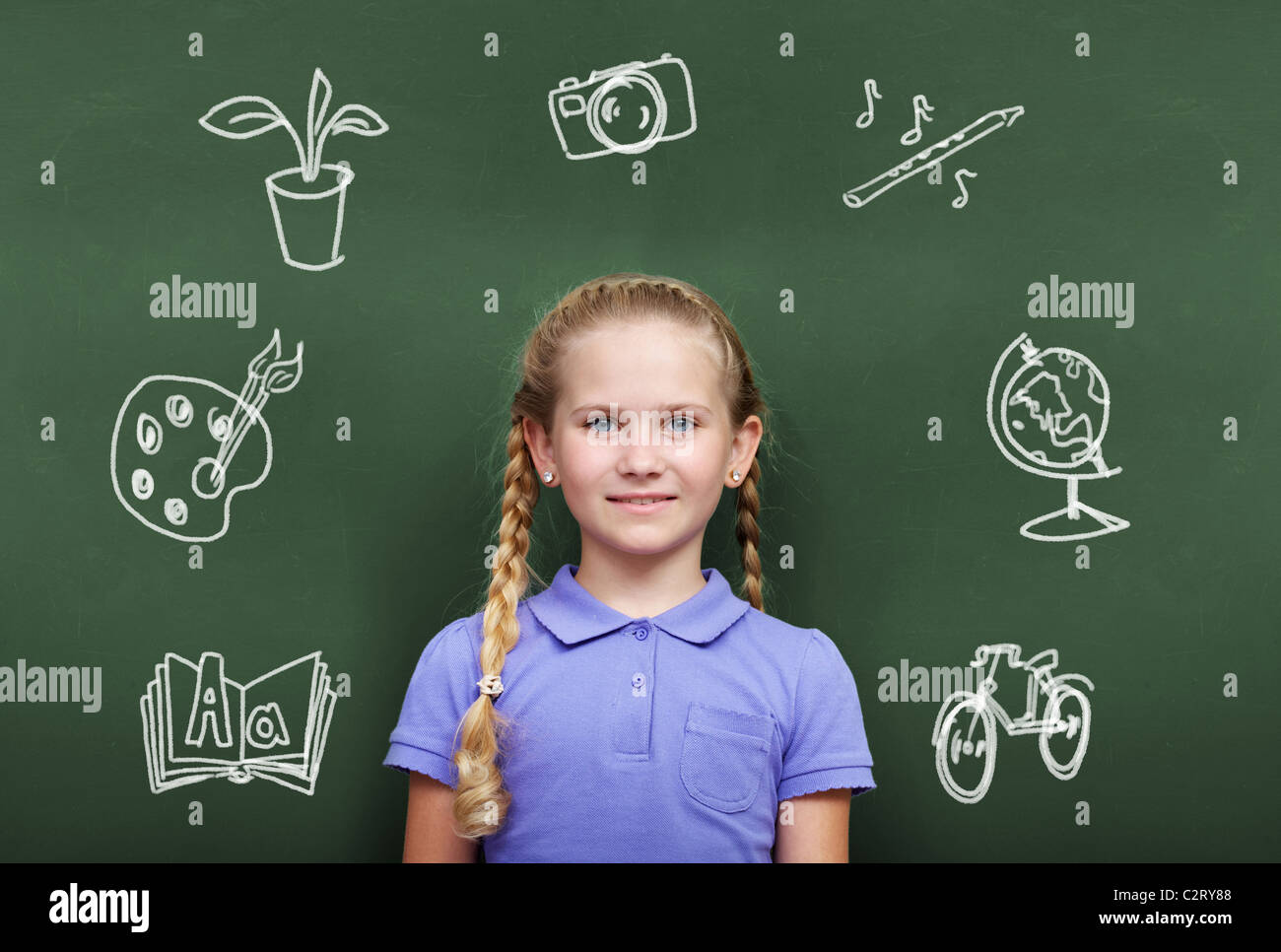 Portrait of smart girl by the blackboard looking at camera Stock Photo ...