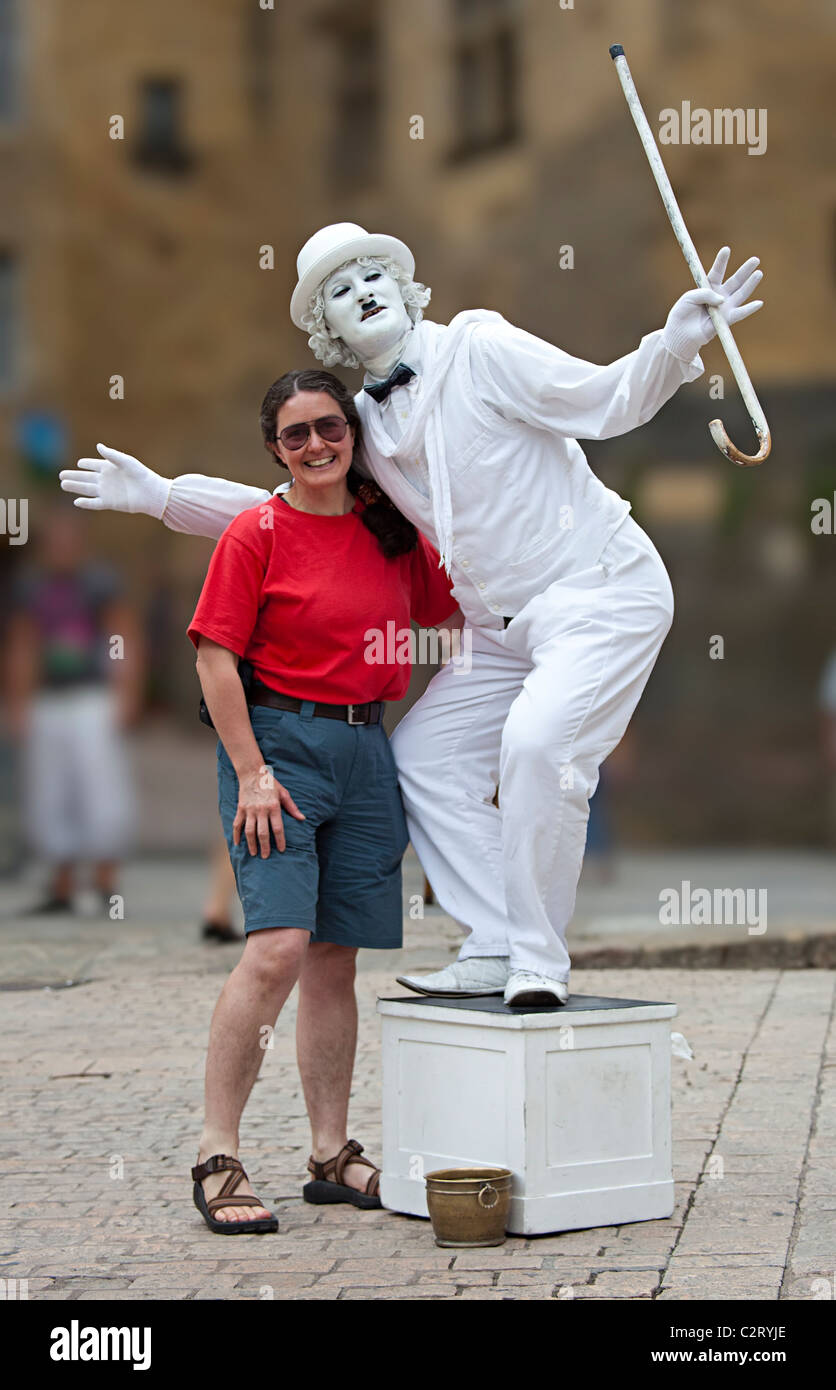 Woman tourist with Living Statue as Charlie Chaplin in Sarlat-la-Caneda ...