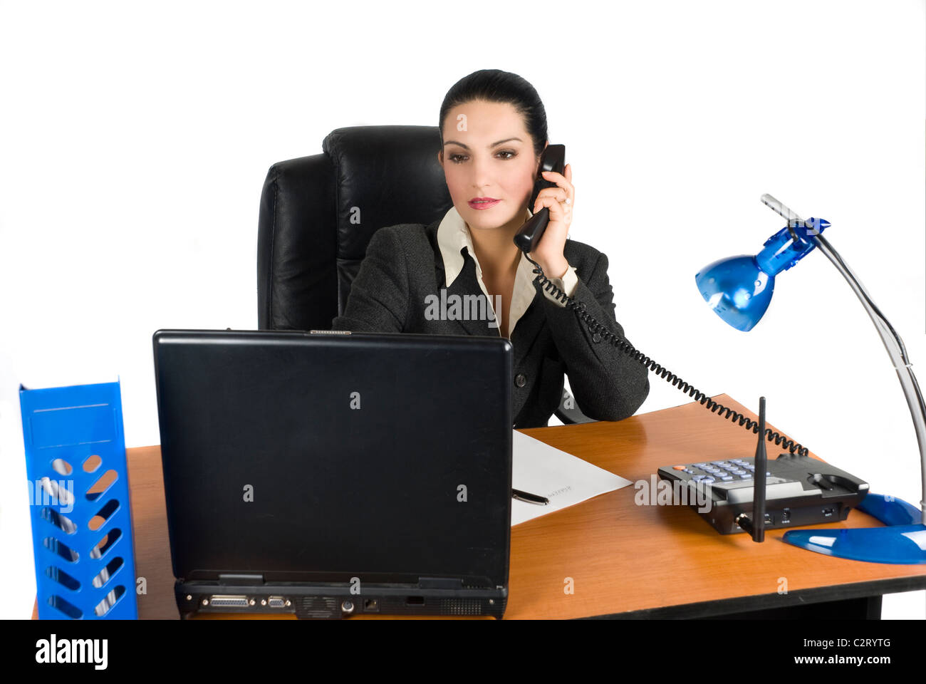 Business woman talking at phone and type on laptop Stock Photo - Alamy