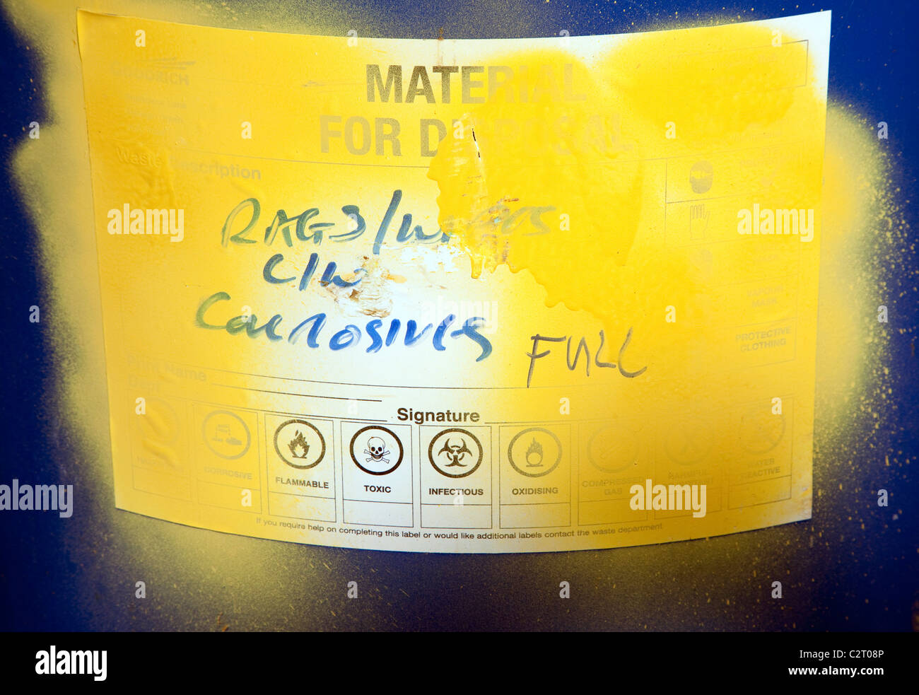 Industrial waste treatment plant, England - warning label on container ...