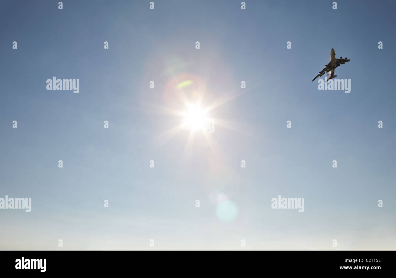 Jet airplane flying afternoon sun hi-res stock photography and images ...