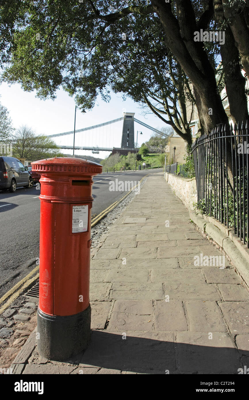 A red post box on Sion Hill in Bristol with the Clifton suspension ...